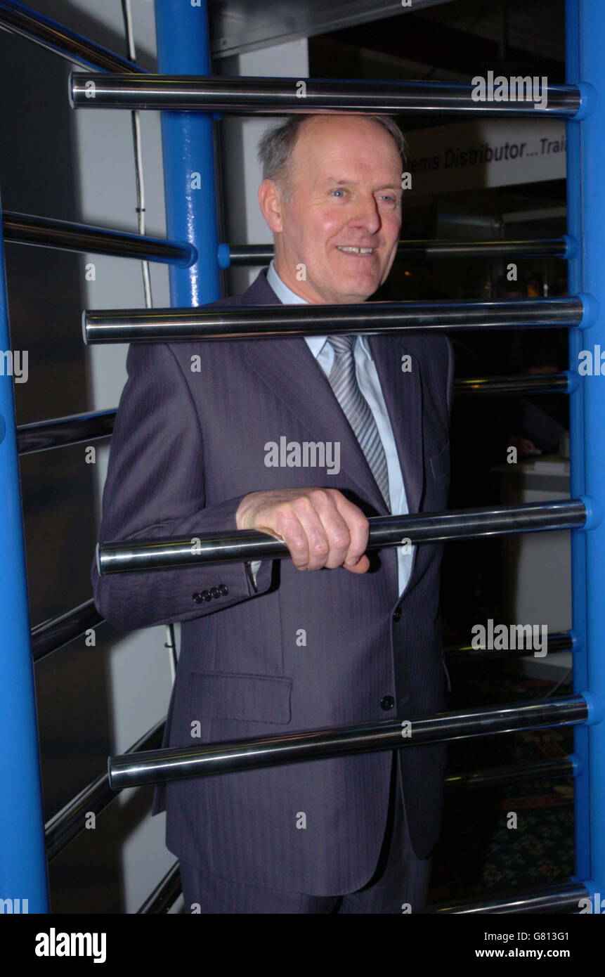 Garda Commissioner Noel Conroy tries out a security turnstile Stock ...