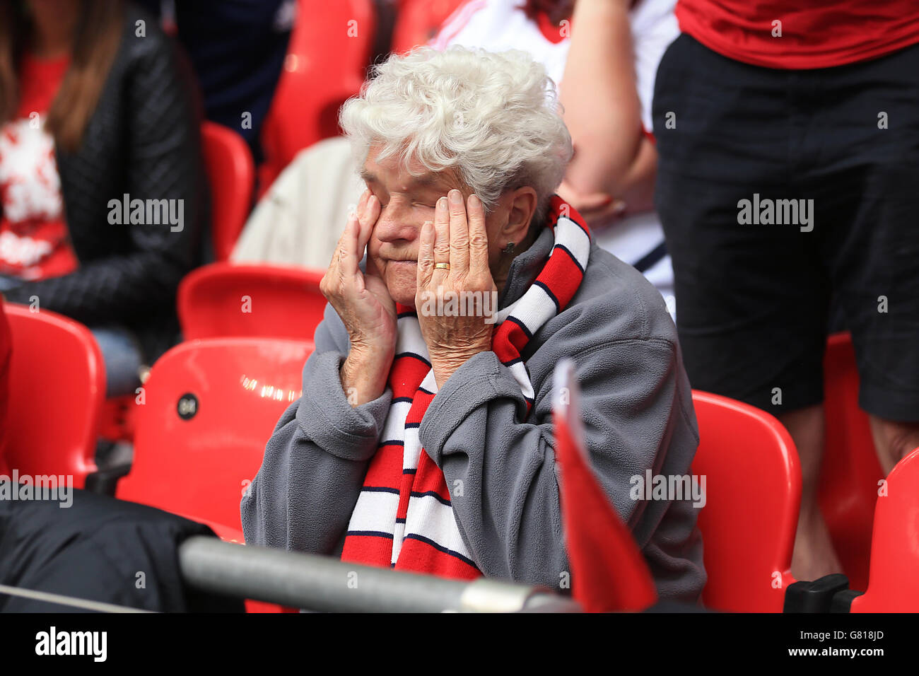 A Middlesbrough fan looks dejected as they see their side concede a ...