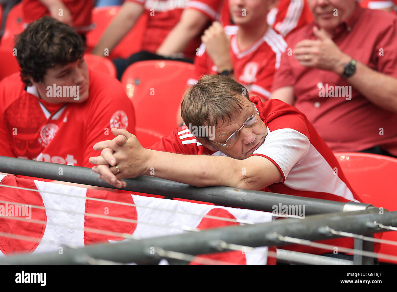 A Middlesbrough fan looks dejected as they see their side concede a ...