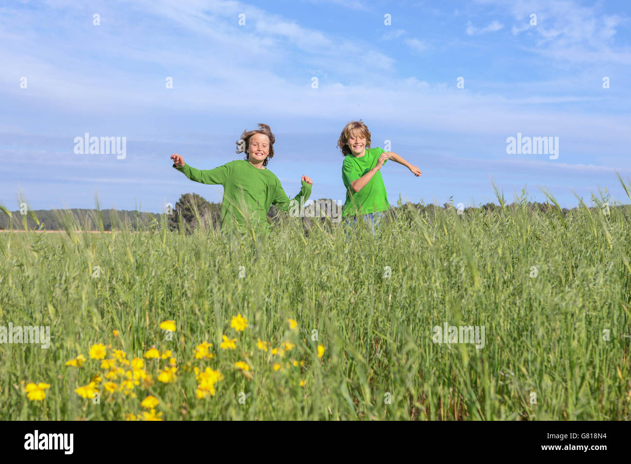 happy healthy kids running, playing, outdoors in summer Stock Photo - Alamy