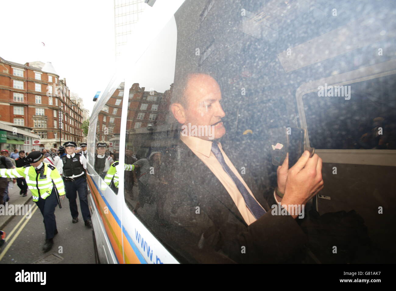 Ukip MP Douglas Carswell is driven away in a police van for his own ...