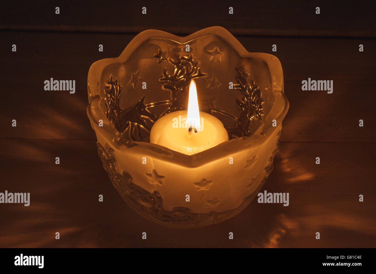 Candle lit in a transparent glass jar Stock Photo - Alamy
