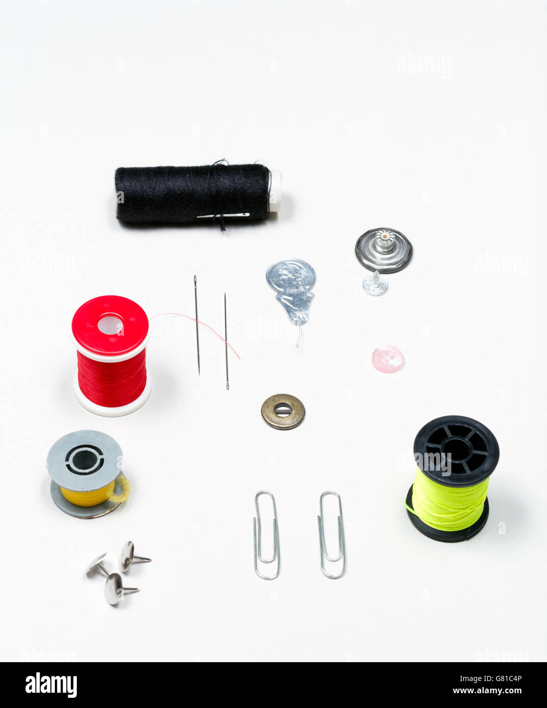 Needle, thread buttons isolated on white background Stock Photo - Alamy