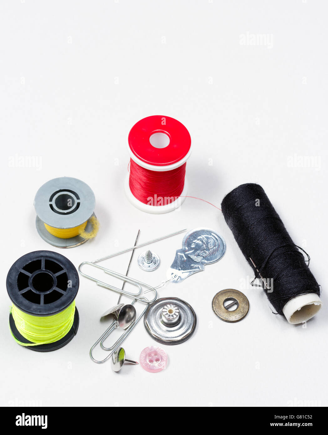 Needle, thread buttons isolated on white background Stock Photo - Alamy