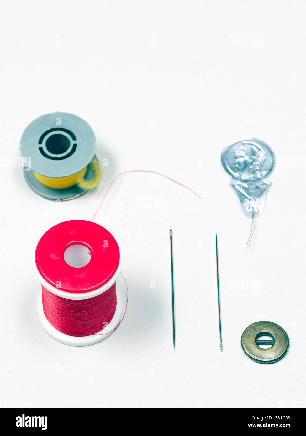 Needle, thread buttons isolated on white background Stock Photo - Alamy