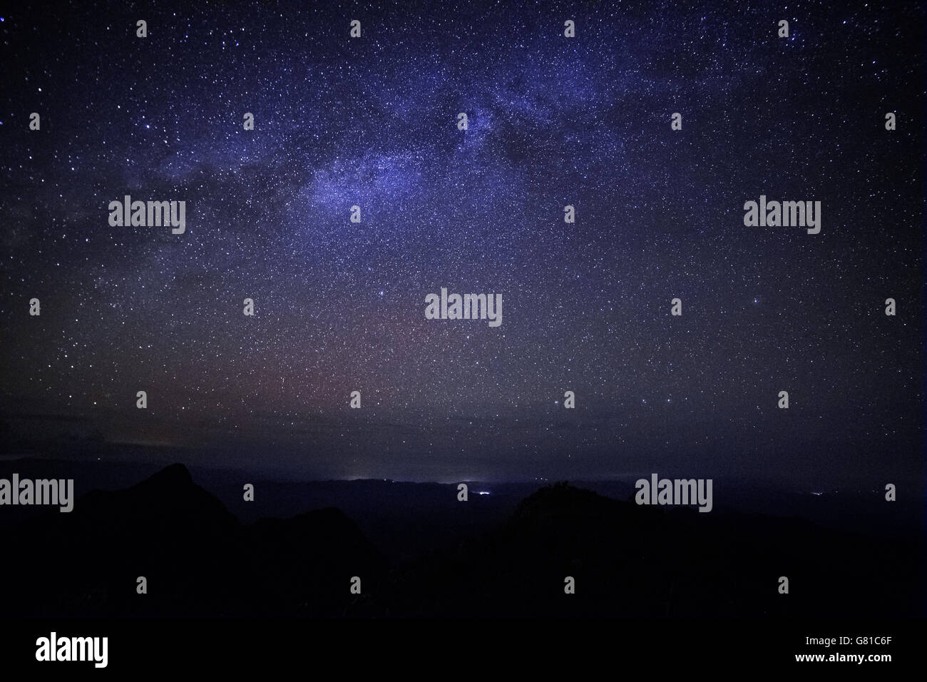 The Milky Way and some trees. In the mountains Stock Photo - Alamy