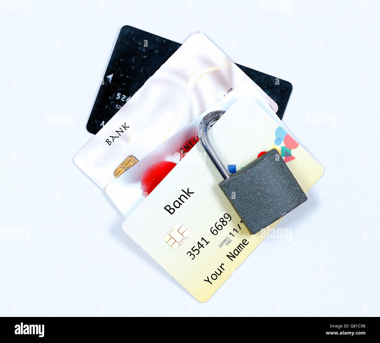 Protection against bank card fraud illustrated with a few cards and a ...