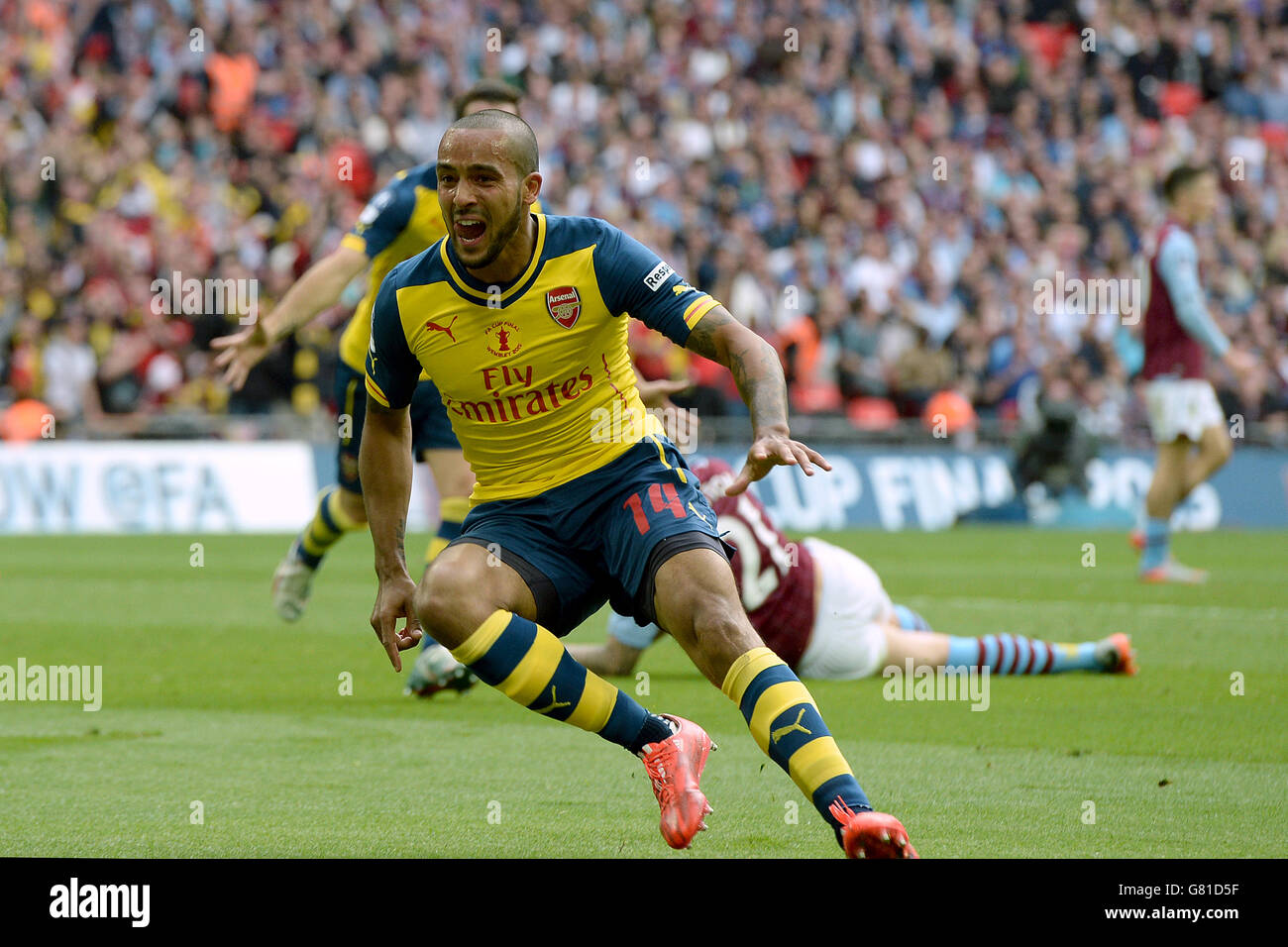 Arsenal's Theo Walcott celebrates scoring his side's first goal during ...