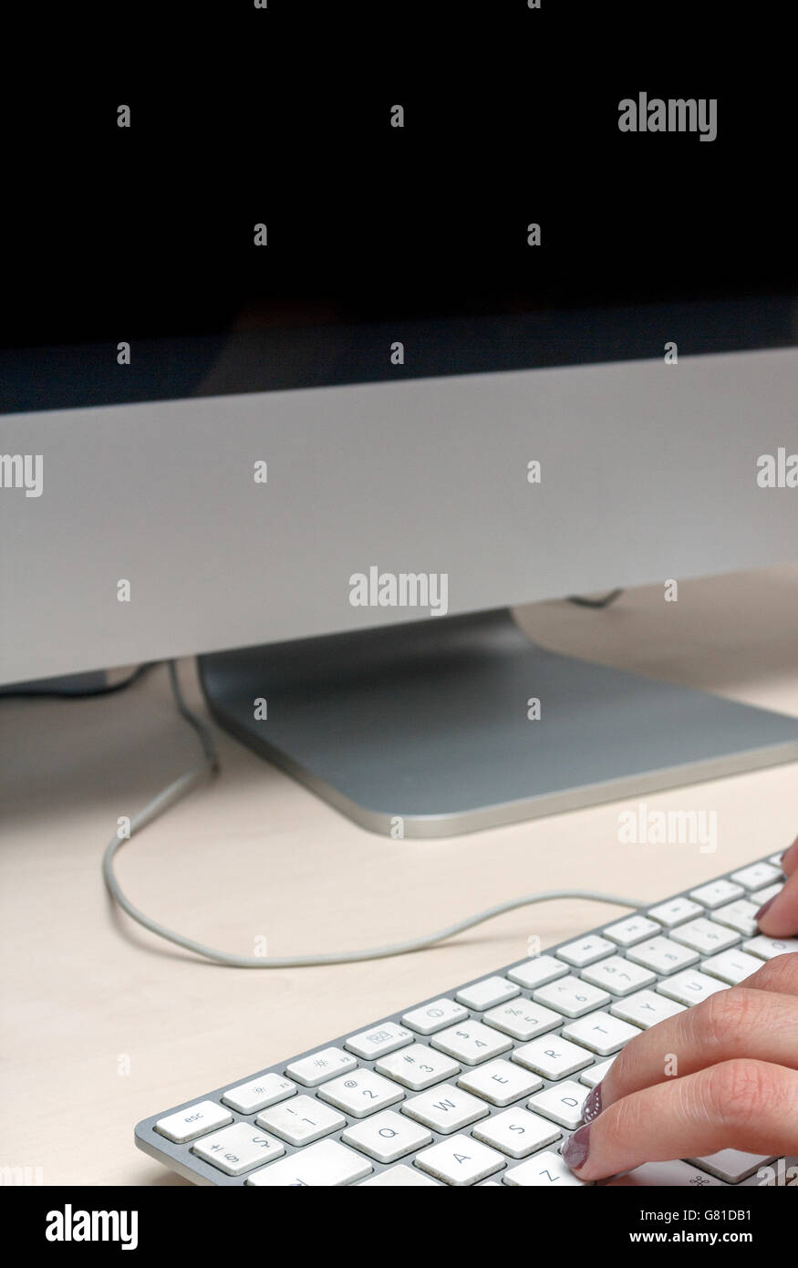 Using desktop computer for bussines figures, data sheet Stock Photo - Alamy