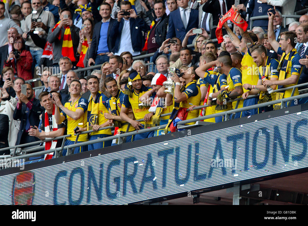 Arsenal players celebrate with the FA Cup Trophy at the end of the FA ...