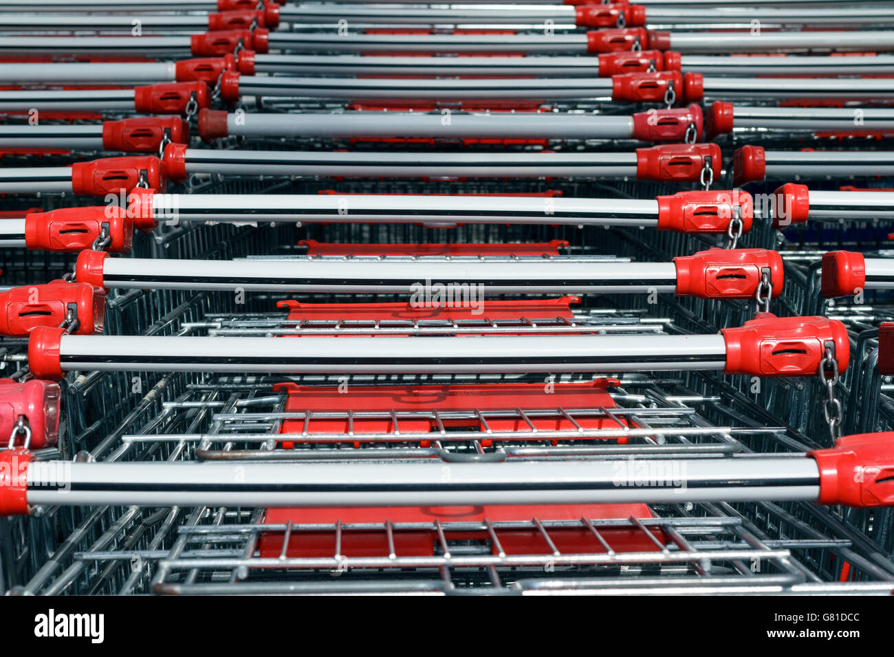 Bunch of shopping carts pulled up together in stack Stock Photo - Alamy