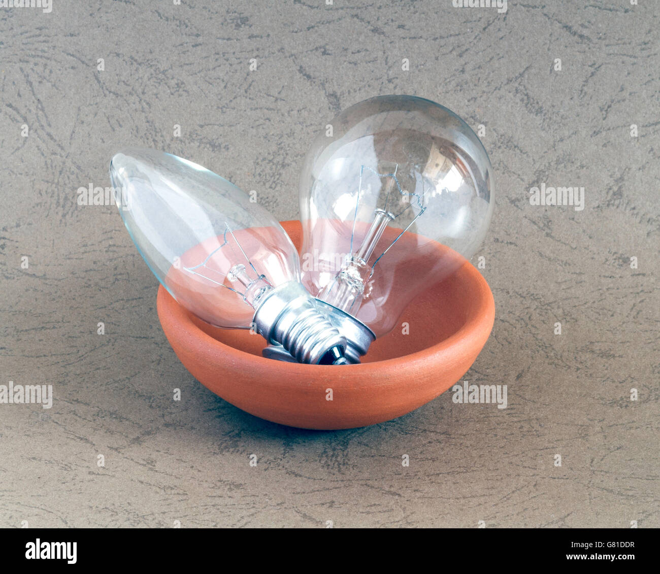 Light bulb in a ceramic bowl isolated on various backgrounds Stock ...