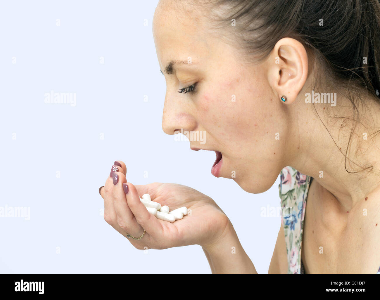 Young women taking pills against various diissease Stock Photo - Alamy