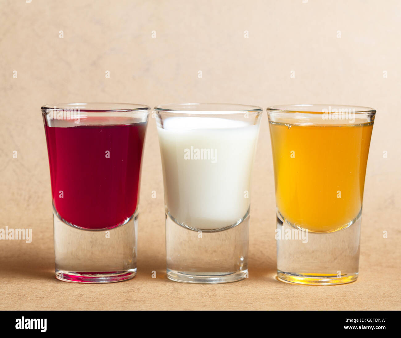 Bunch of shots, filled with water, apple juice, wine, sparkling and ...