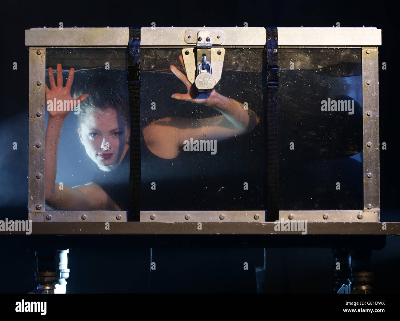 Escapologist's assistant Josephine Wormall performs a water tank stunt ...