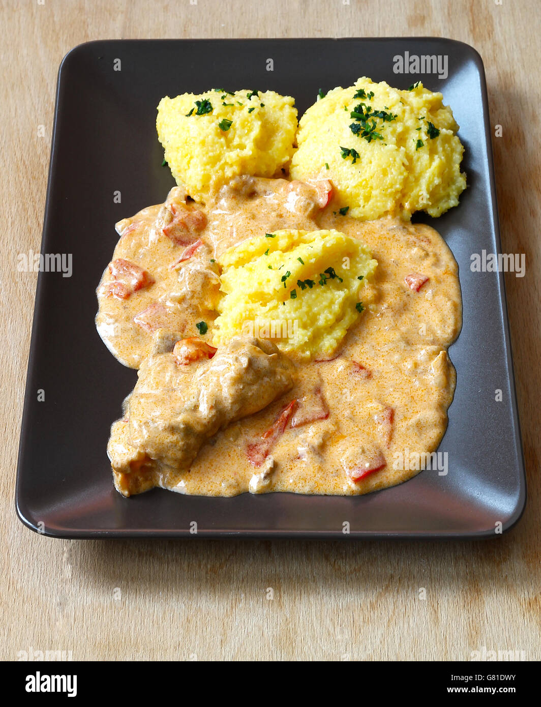 Traditional transylvanian meal made from chicken meat, polenta, sour ...