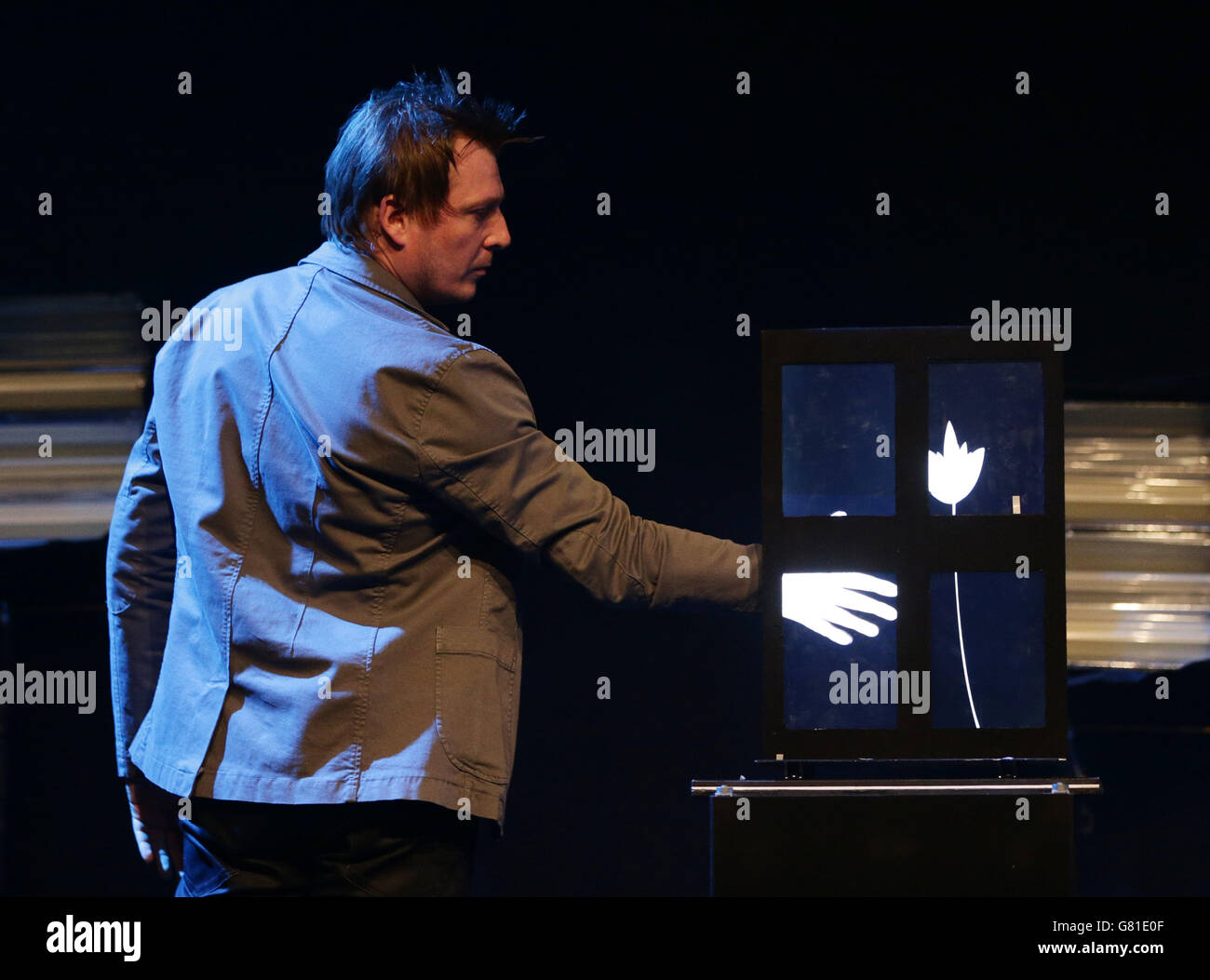 Magician Jamie Allan performing a digital illusion using iPads, during ...