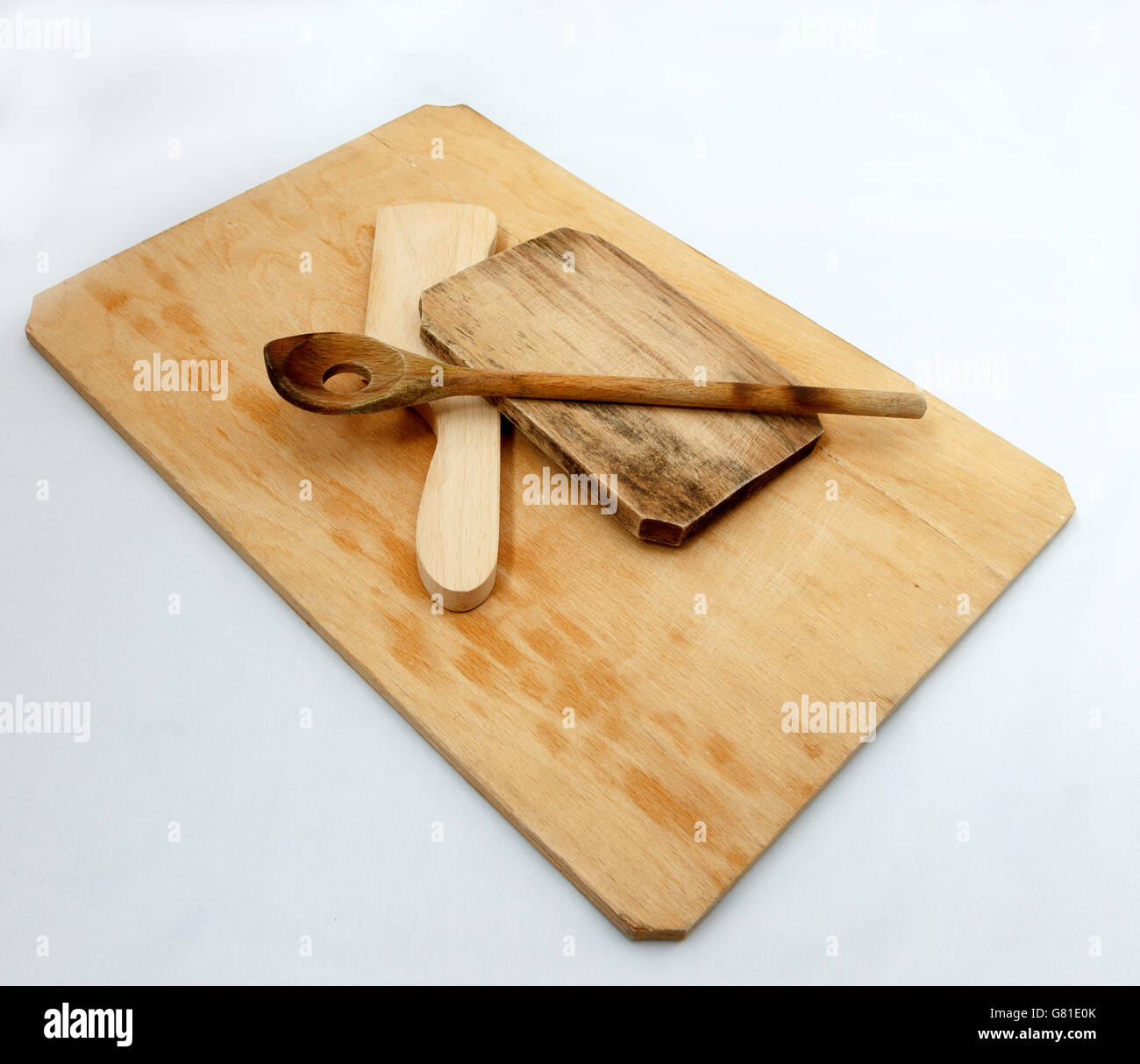 Wooden cutboard and kitchen tools isolated on white Stock Photo - Alamy