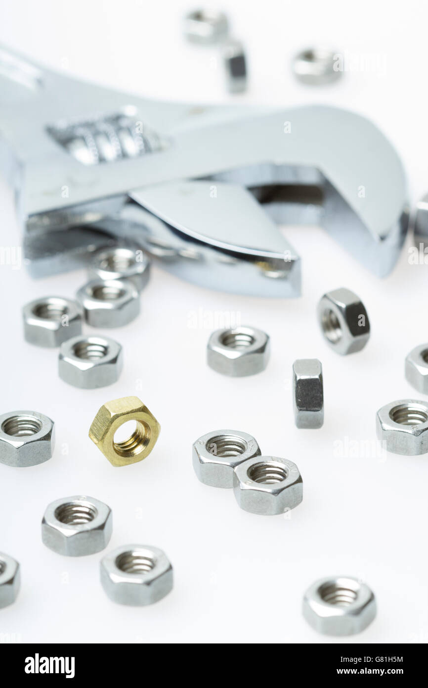 Wrench and metallic nuts Stock Photo - Alamy