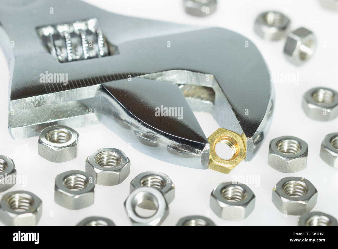 Wrench and metallic nuts Stock Photo - Alamy