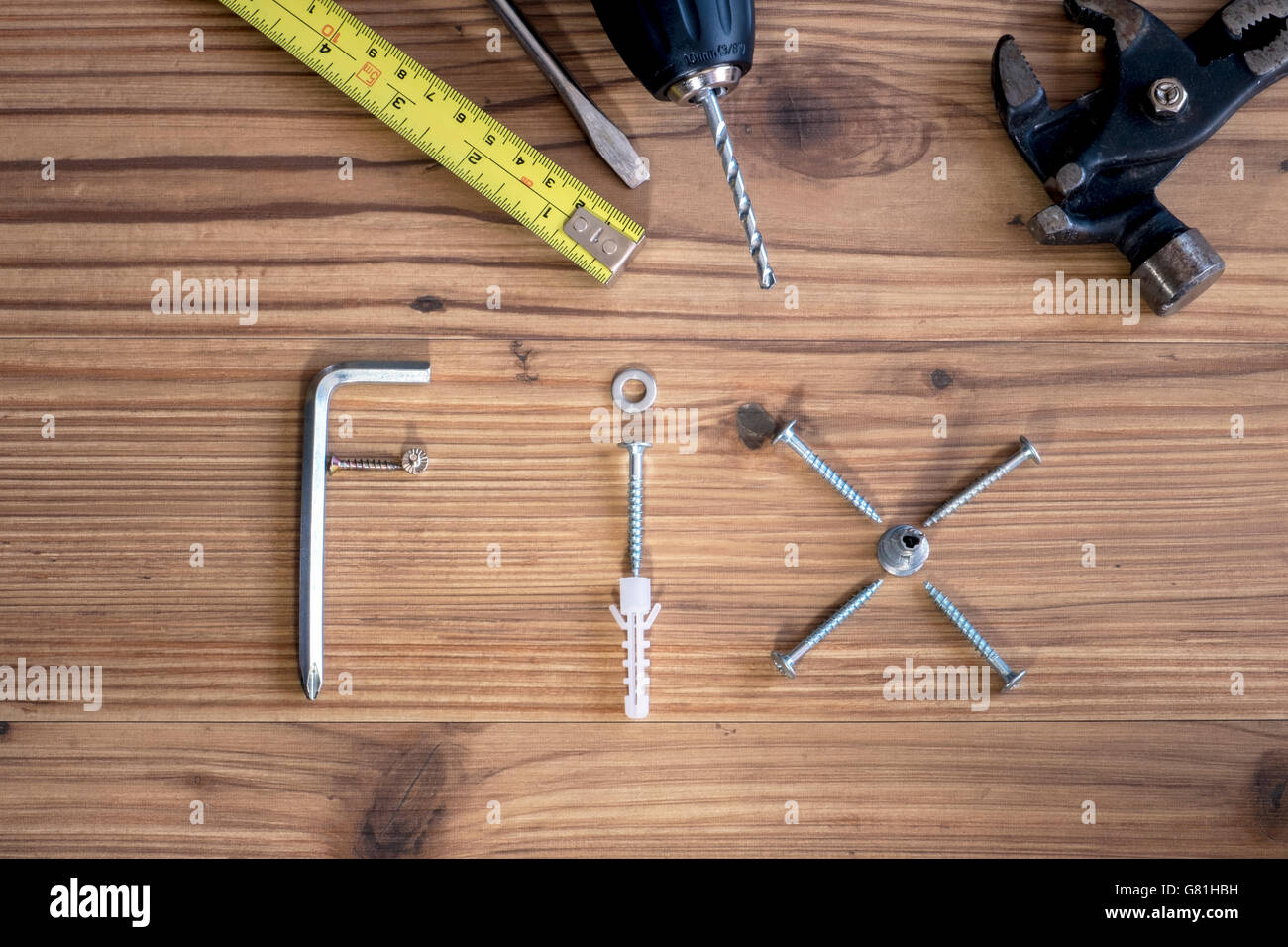 Selection of DIY accessories on wooden background representing the word ...