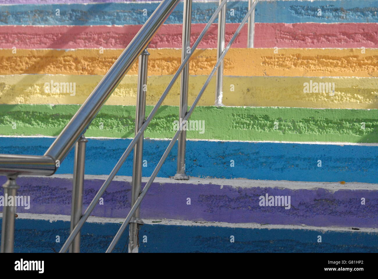 Colorful stairs with chromium-plating handrails Stock Photo - Alamy