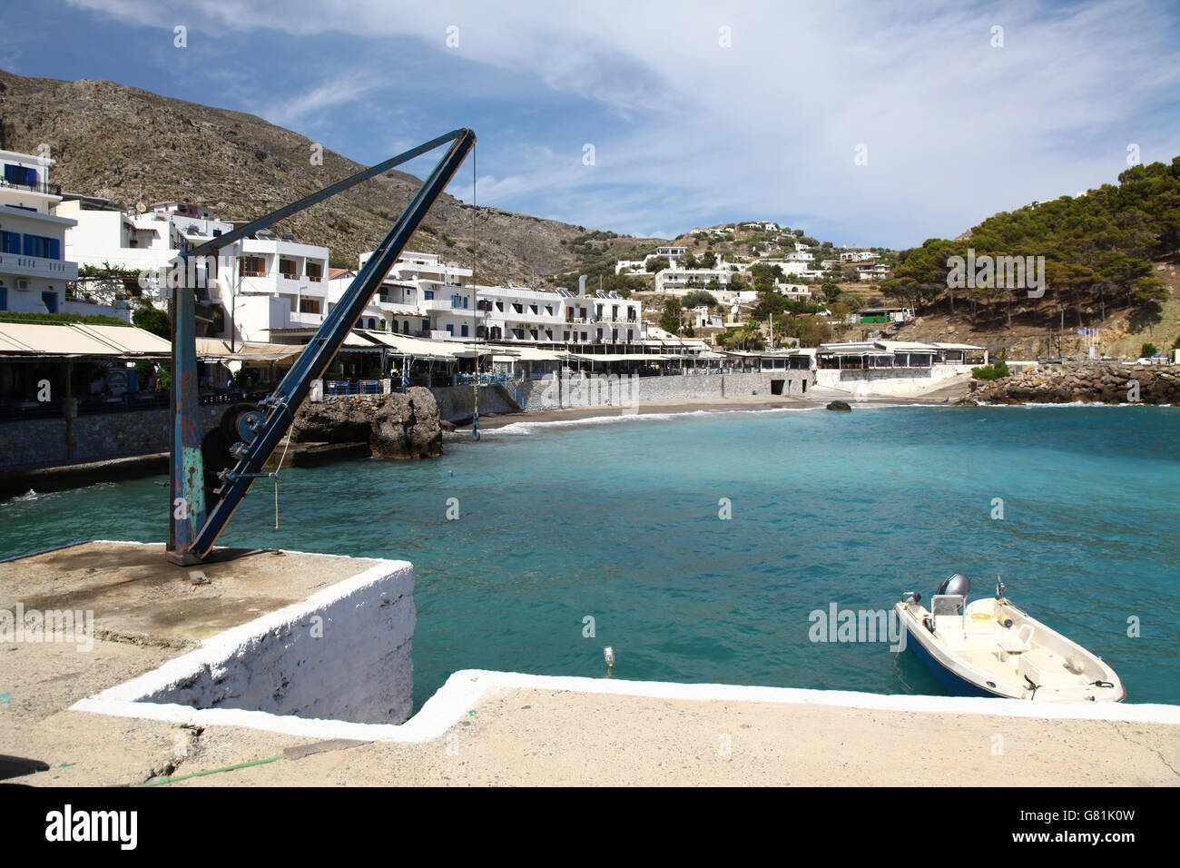 A small port and fishing village popular with tourists laying on the ...