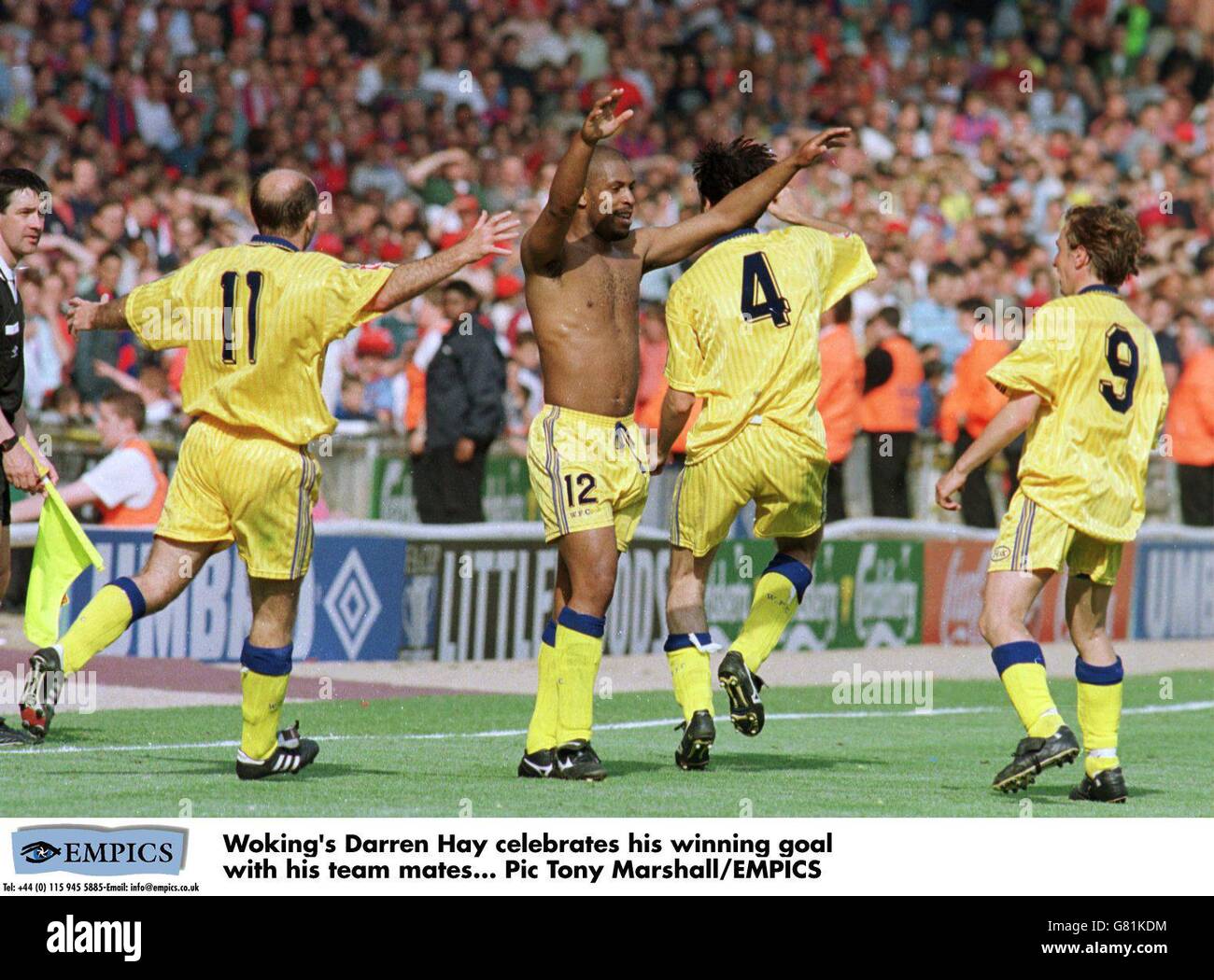 Woking's Darren Hay celebrates his winning goal with his team mates ...