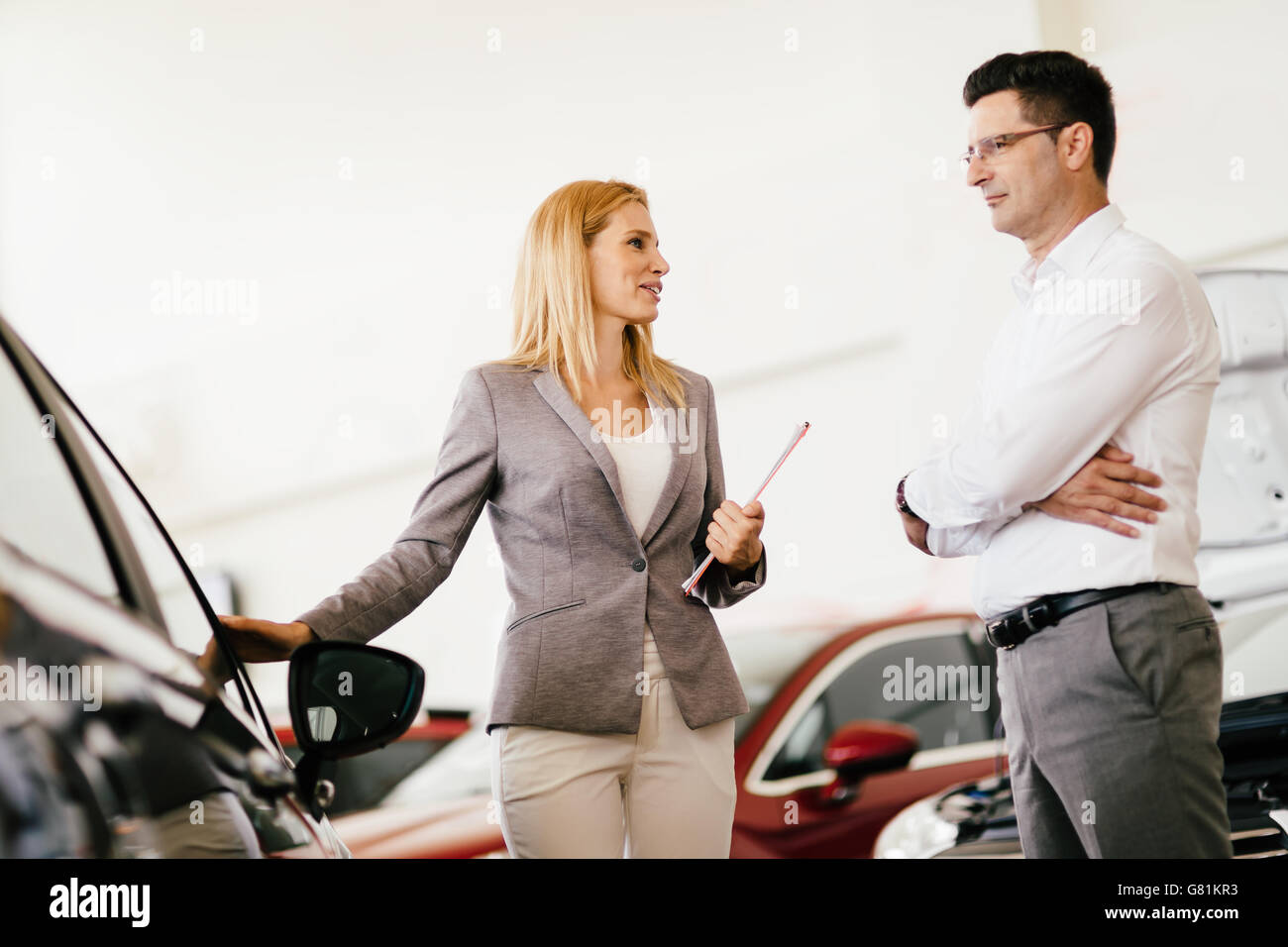 Salesperson showing vehicle potential hi-res stock photography and ...