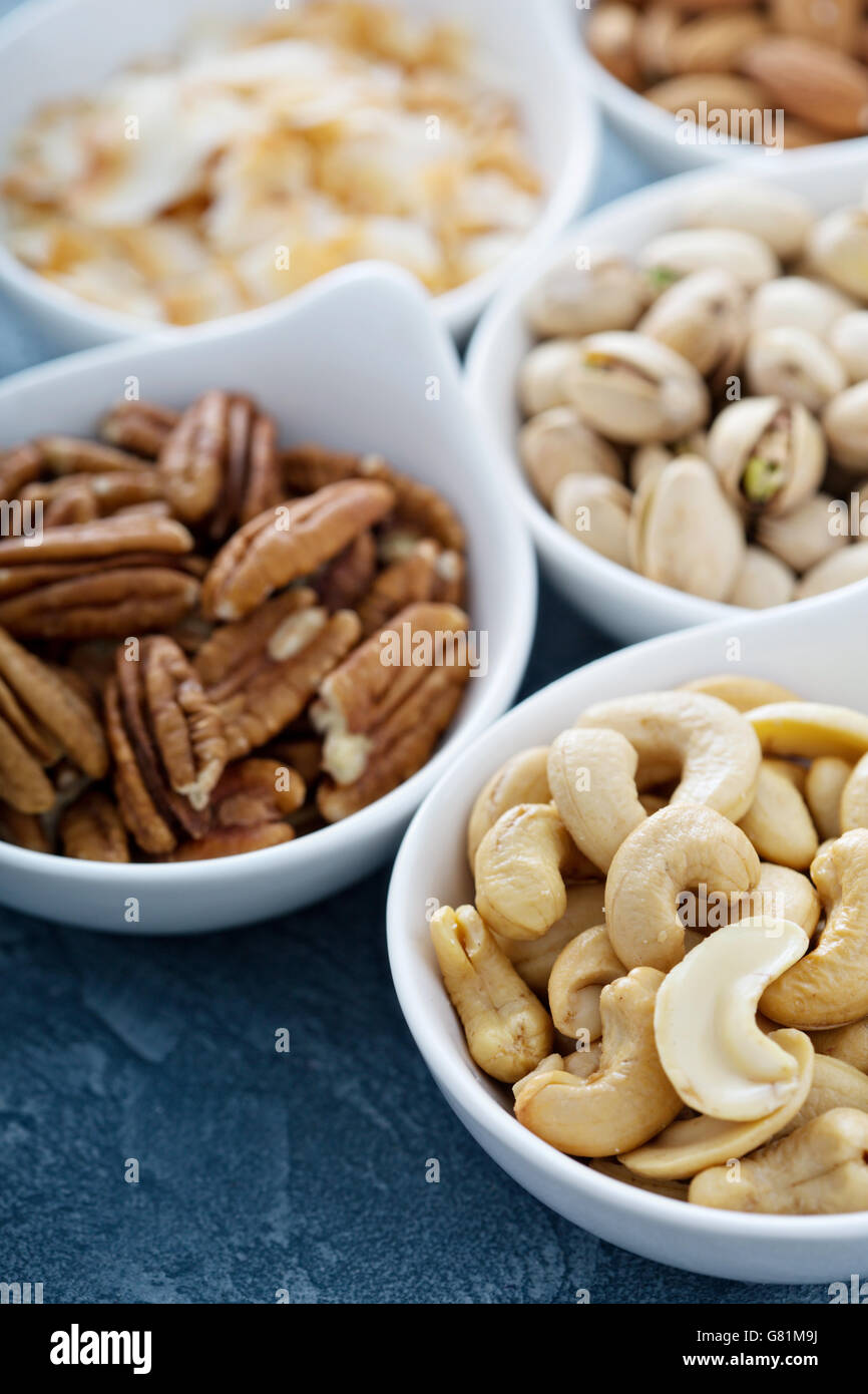 Variety of nuts in small bowls Stock Photo - Alamy