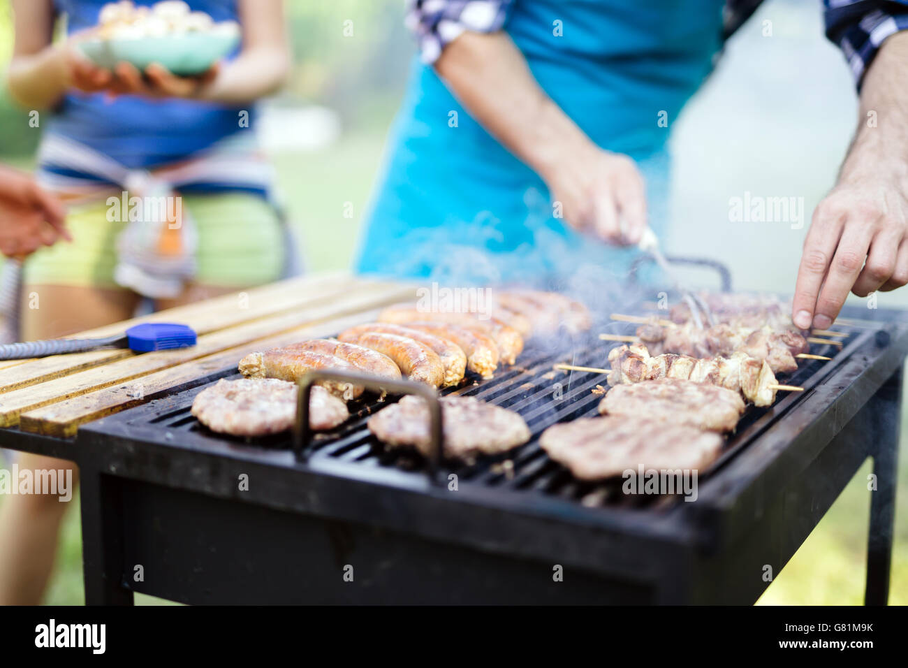 Grilled meat being done outdoors Stock Photo - Alamy