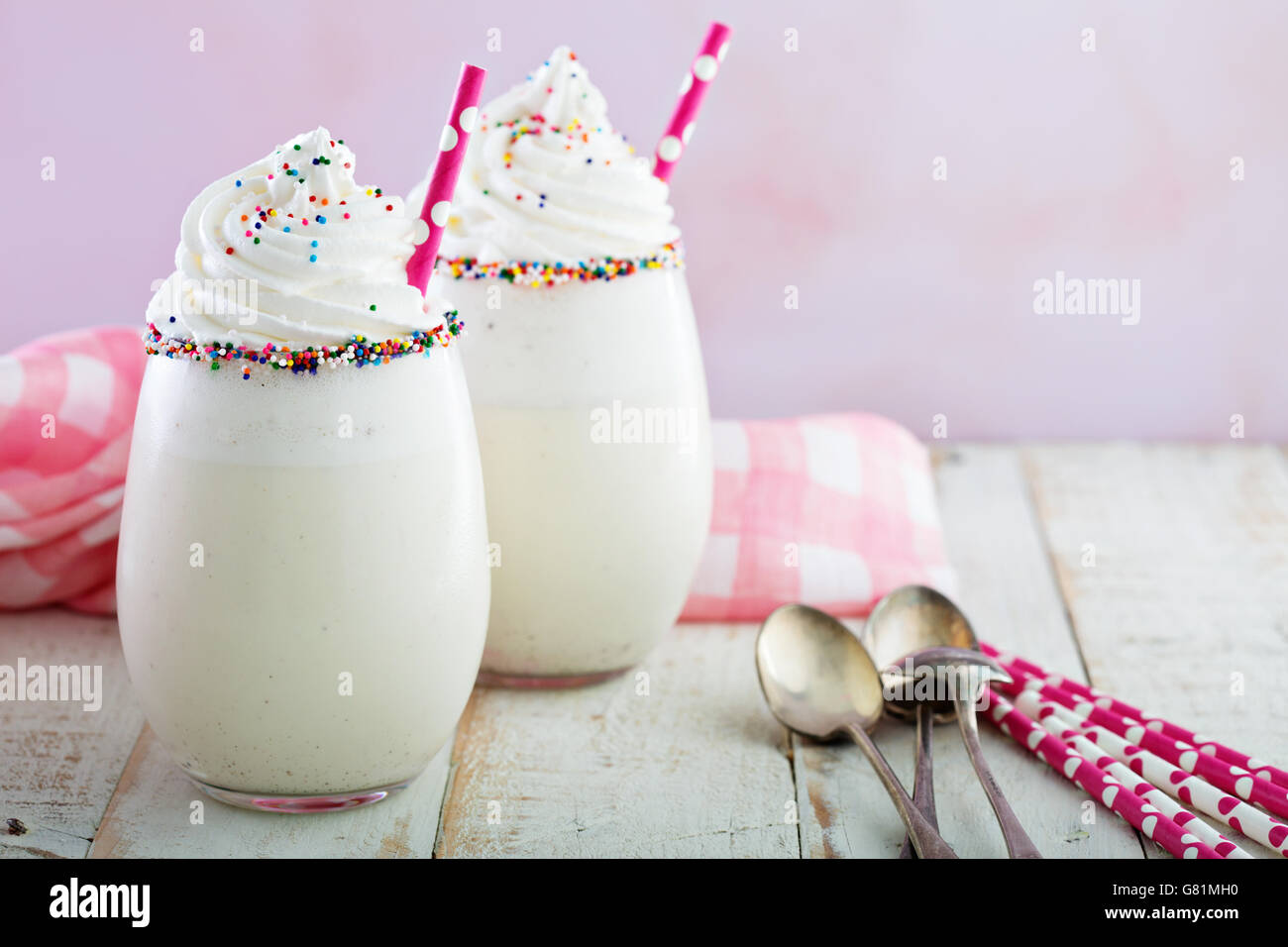 Vanilla milkshake with whipped cream and sprinkles Stock Photo - Alamy