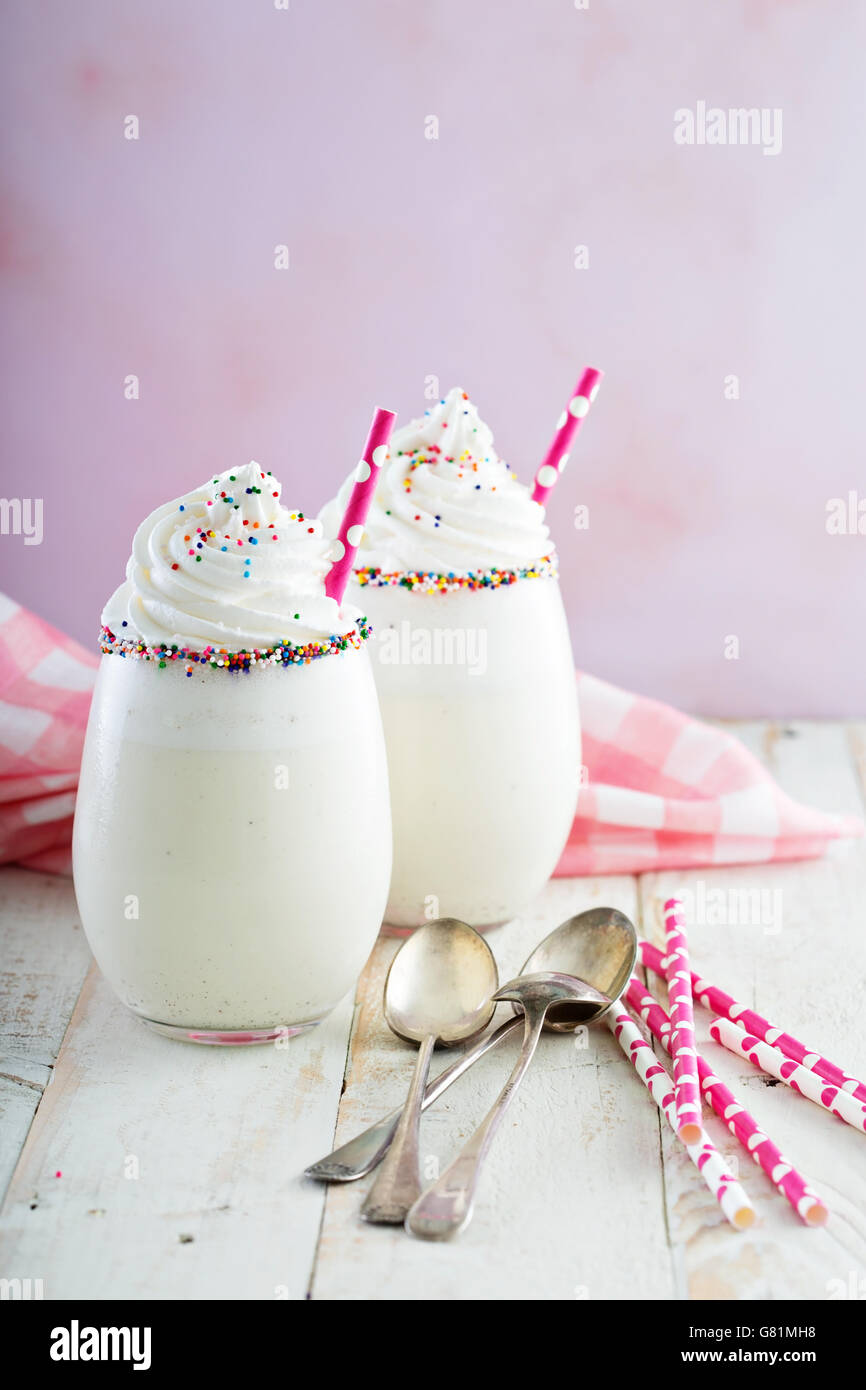 Vanilla milkshake with whipped cream and sprinkles Stock Photo - Alamy