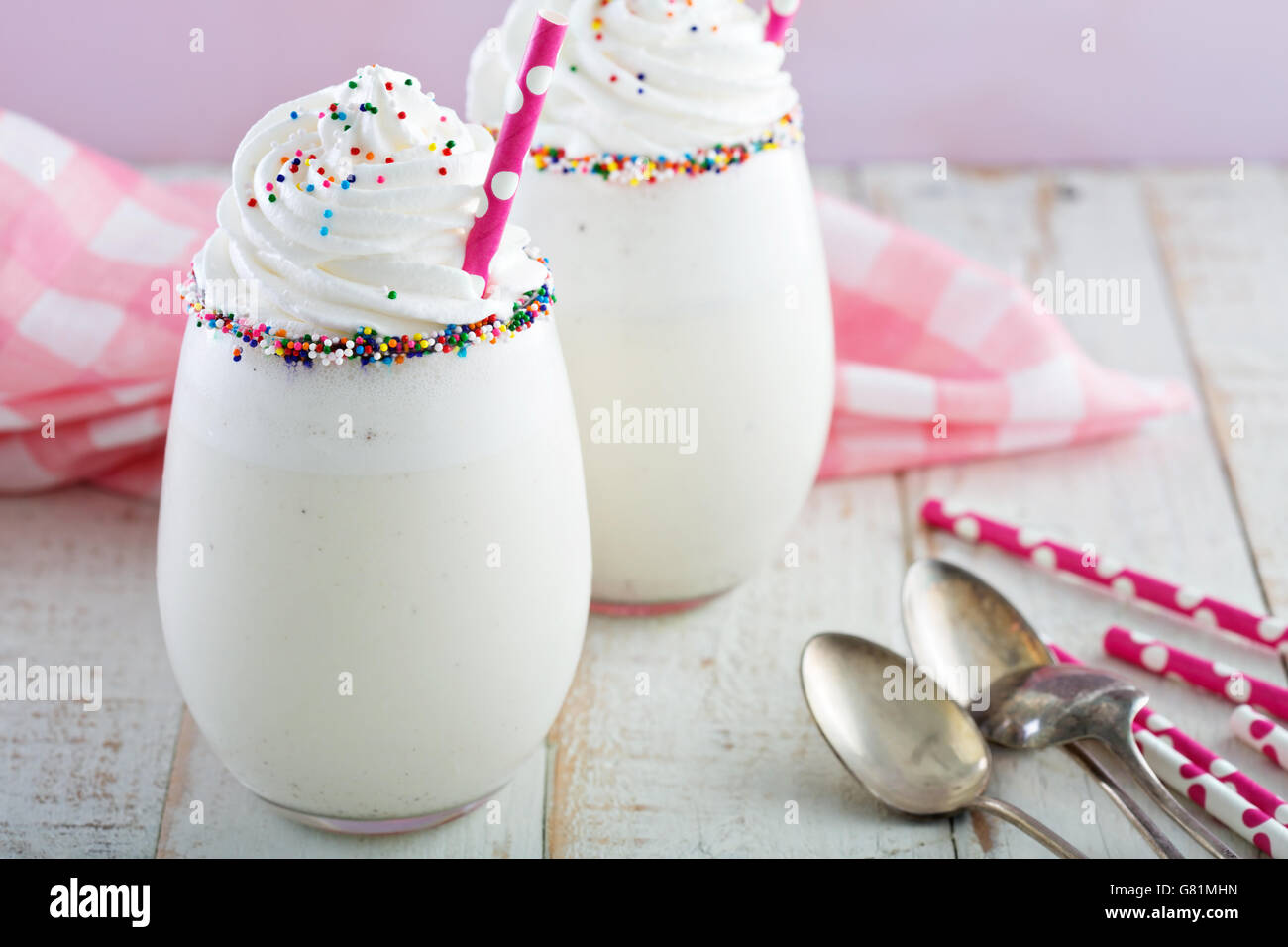 Vanilla milkshake with whipped cream and sprinkles Stock Photo - Alamy