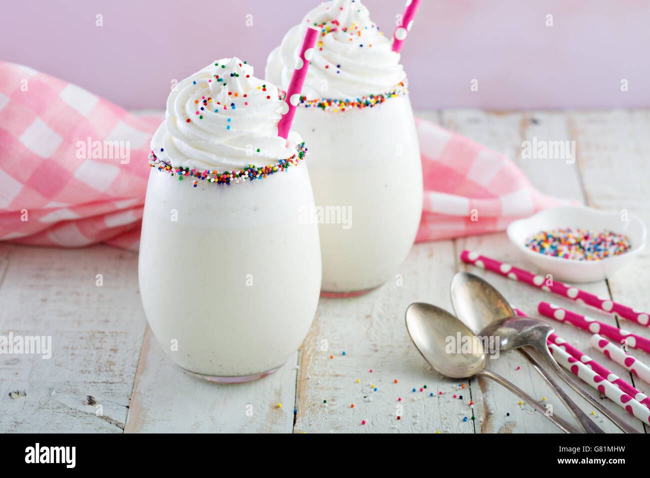 Vanilla milkshake with whipped cream and sprinkles Stock Photo - Alamy