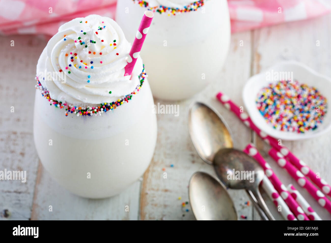 Vanilla milkshake with whipped cream and sprinkles Stock Photo - Alamy