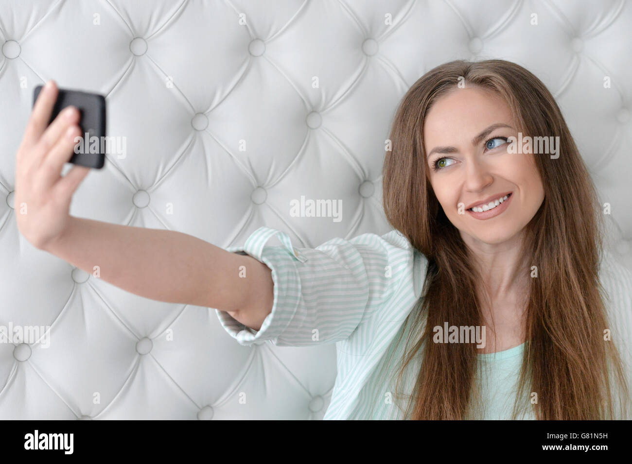 Pretty girl taking selfie Stock Photo - Alamy