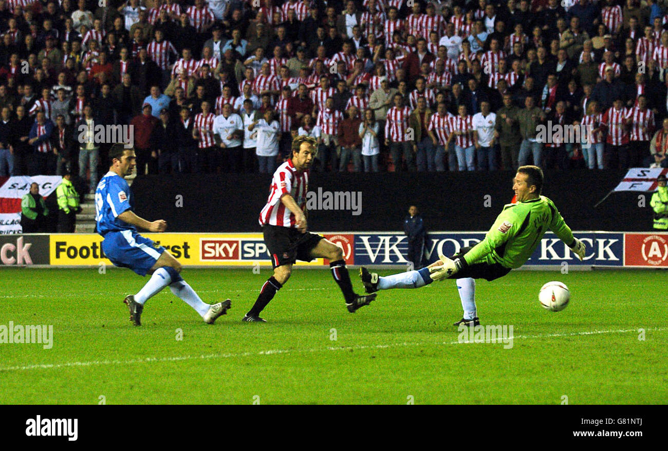 Sunderland's Marcus Stewart scores the opening goal against Wigan ...