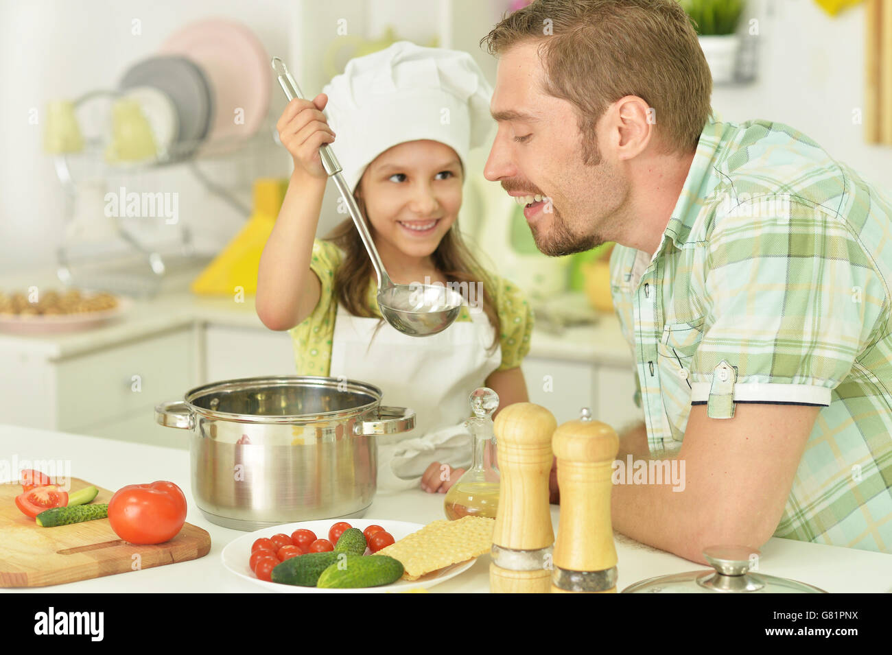 father and daughter with food Stock Photo - Alamy