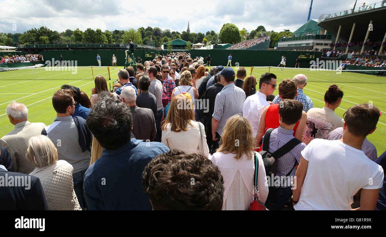 People watch play on courts 4 and 5 on day one of the Wimbledon ...