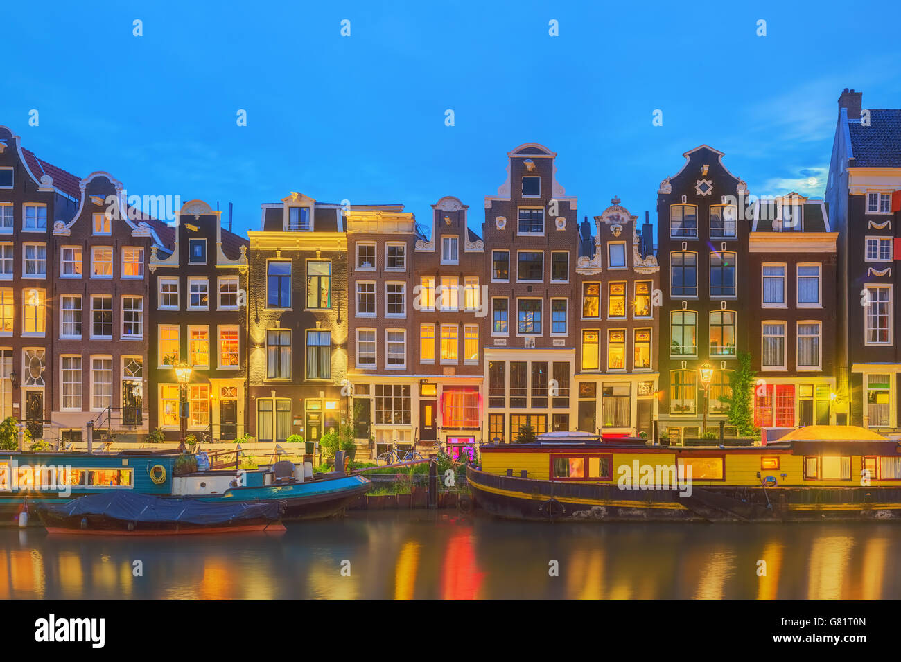 Amstel river, canals and night view of beautiful Amsterdam city ...