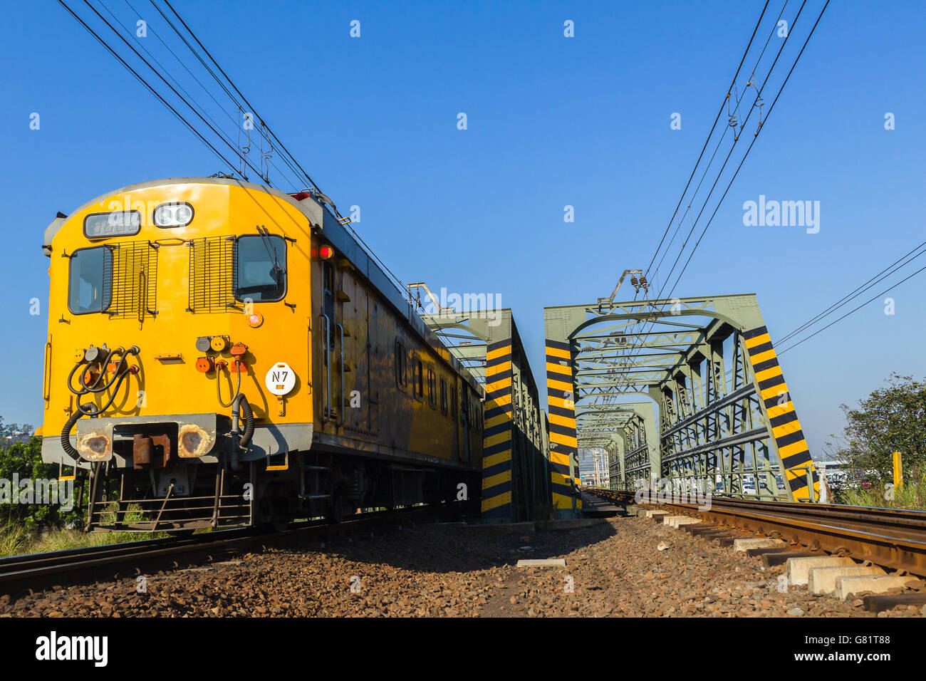 Train crossing railway steel bridge closeup photo on tracks Stock Photo ...
