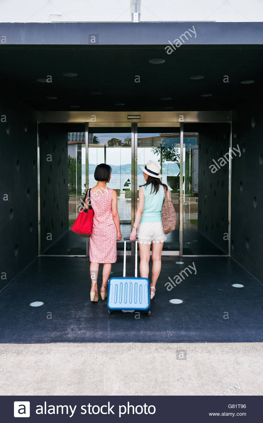 Two People Entering High Resolution Stock Photography and Images - Alamy