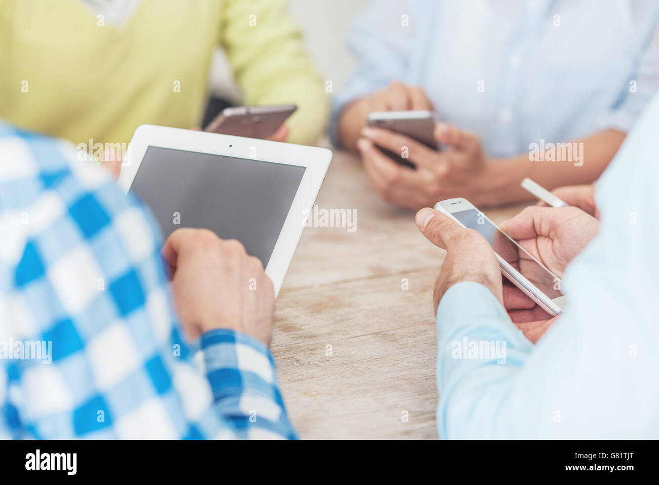 Group of diverse people using digital devices Stock Photo - Alamy