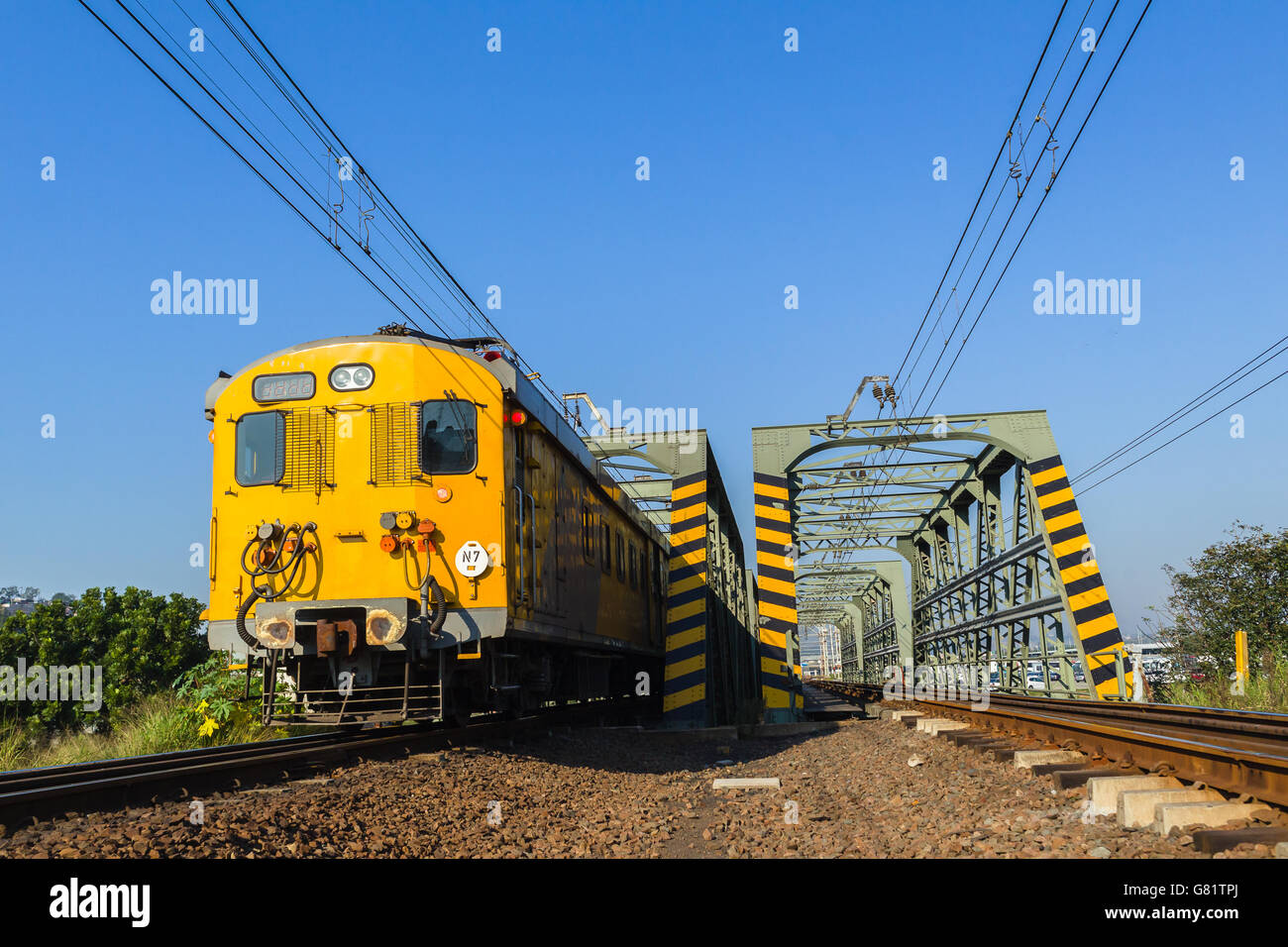 Train crossing railway steel bridge closeup photo on tracks Stock Photo ...