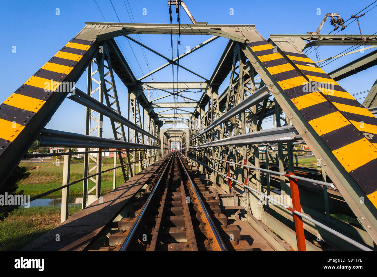 Railway train tracks steel bridge structure at river crossing closeup ...