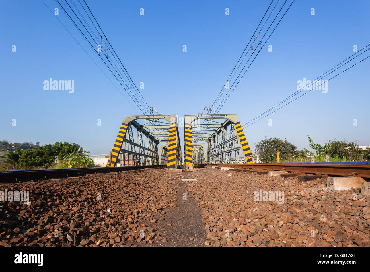Railway train tracks steel bridge structure at river crossing closeup ...