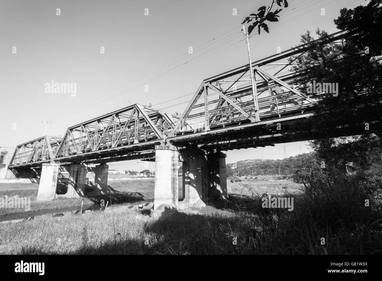 Railway train tracks steel bridge structure at river crossing closeup ...