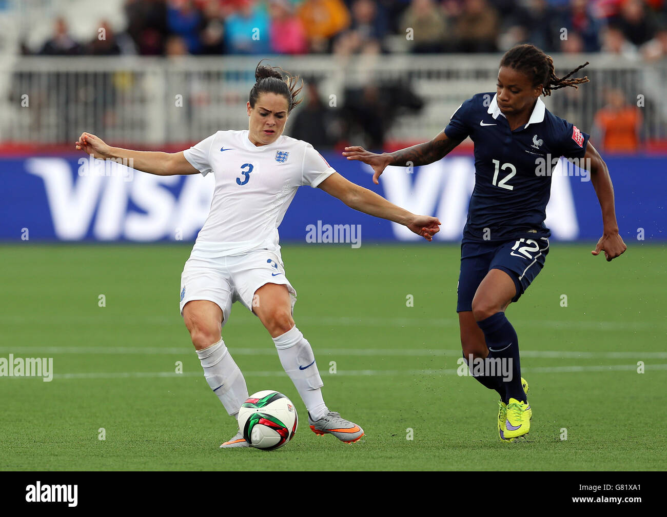 England's Claire Rafferty (left) passes the ball as she is under ...