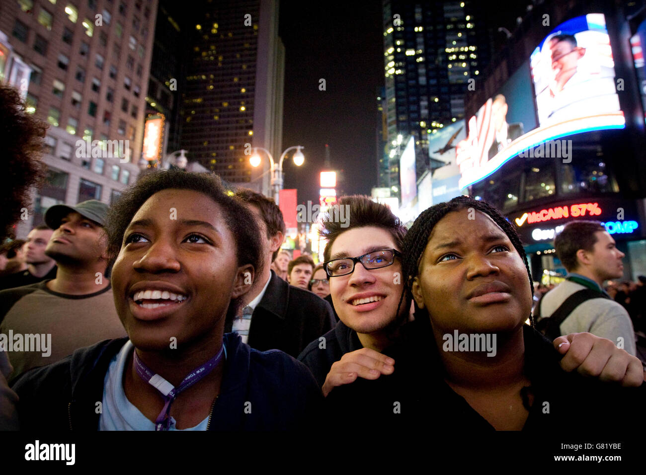 People listen to Barack Obama's acceptance in the 2008 US presidential ...